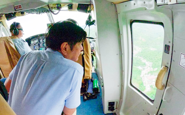 Marcos checks site of landslide that buried buses in Davao de Oro
