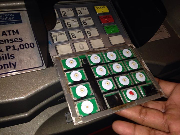 BPI cleans skimming device from ATM in Global City | GMA News Online
