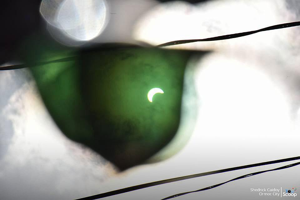 Photographer uses three filters to view solar eclipse in Cebu | Photos ...
