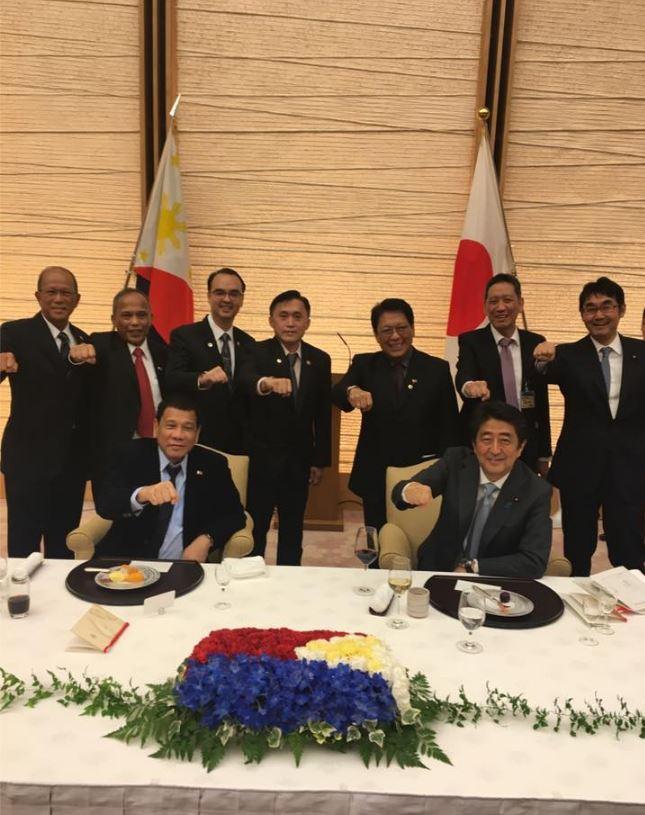 Japan's PM Abe poses doing Duterte's trademark fist gesture | GMA News ...