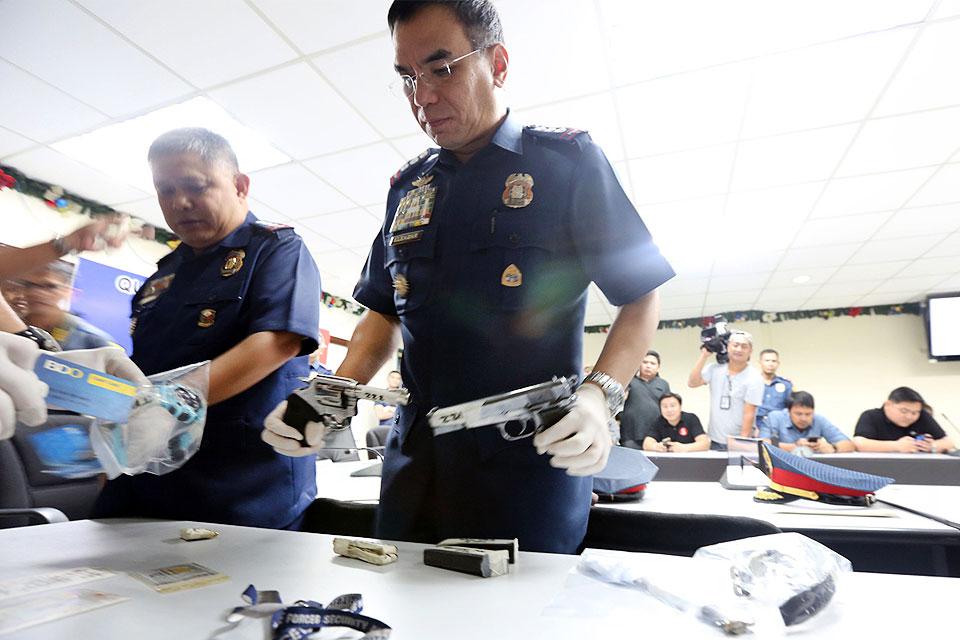 QCPD arrests gunrunning 'sekyu' | Photos | GMA News Online