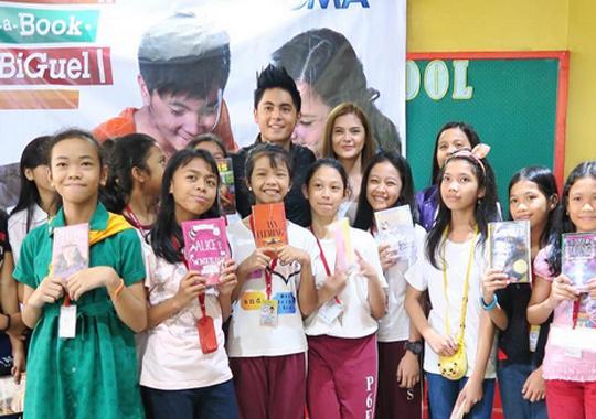 BiGuel inspires elementary students in QC through Pass-A-Book | GMA ...