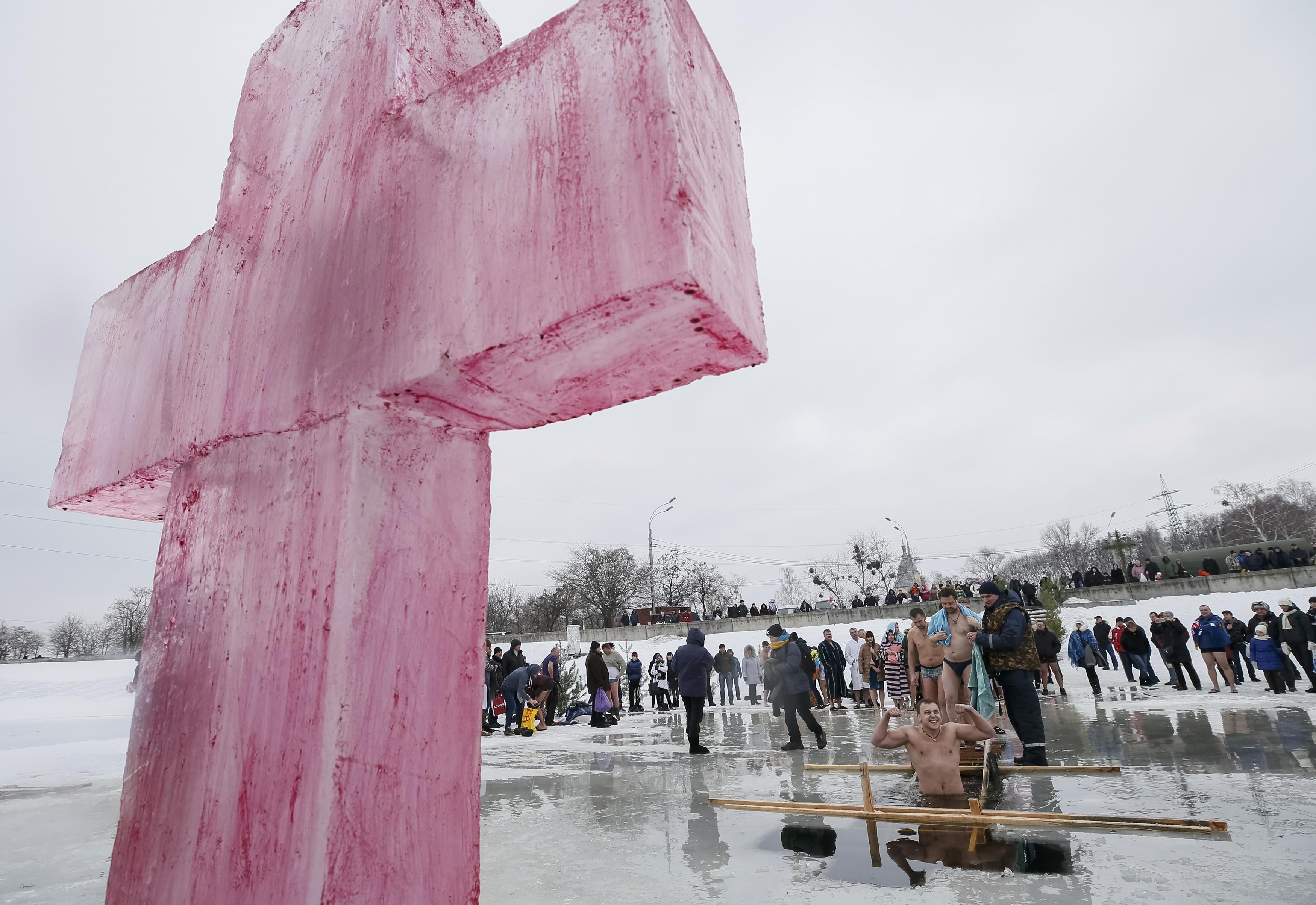 Russian Orthodox believers take icy plunge on Epiphany day | GMA News ...