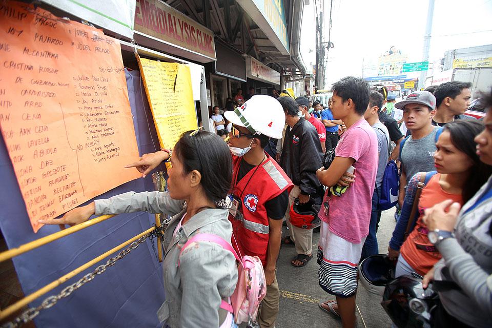 Relatives start search for HTI fire victims | Photos | GMA News Online