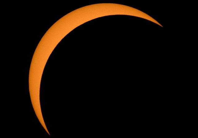 ISS photobombs eclipse, takes photo of Moon’s shadow on Earth from ...