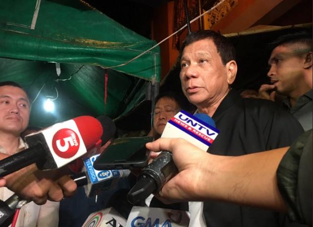 Duterte visits wake of police officer killed in shootout with drug ...