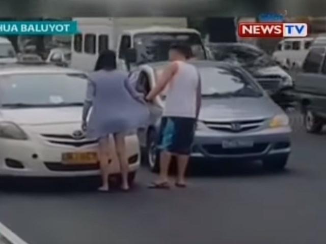 Woman in viral road rage video denies hurting taxi driver | GMA News Online