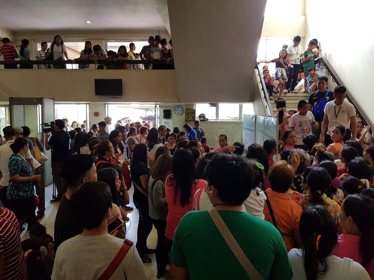 Parents with children vaccinated with Dengvaxia troop to PAO building ...