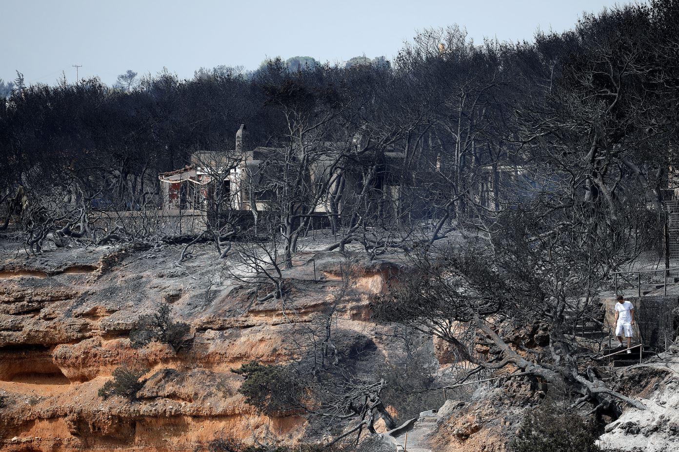 Wildfires kill at least 74 near Athens, families found in last embrace ...