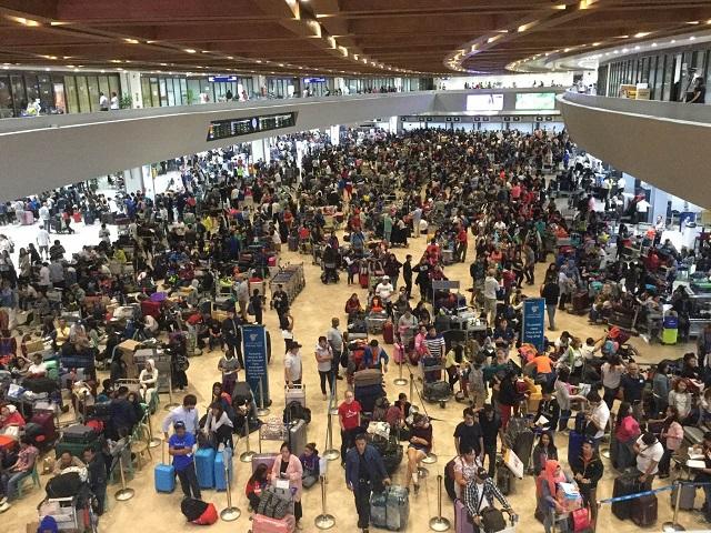NAIA crowded with passengers waiting for flights a day after runway ...
