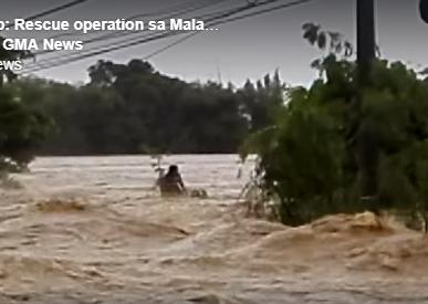 Rescuers save man from angry flood in breath-taking rescue operation ...