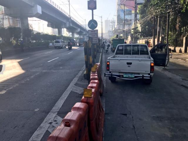 Road reblocking at foot of EDSA-Quezon Avenue flyover causing traffic ...