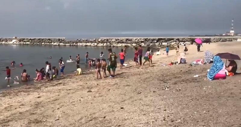 Residents enjoy Manila Bay’s ‘Baseco Beach’ despite water pollution ...