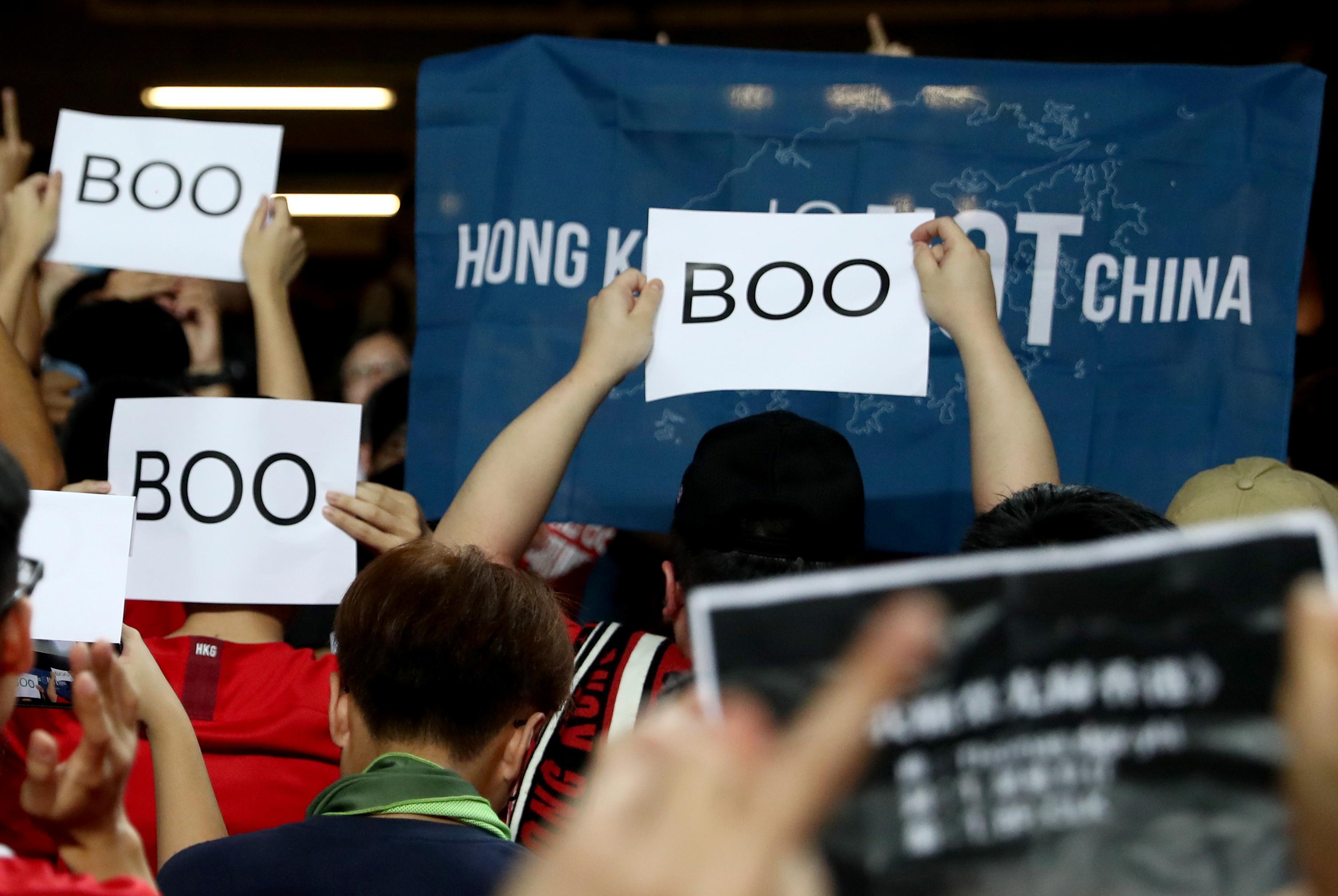 Hong Kong protesters boo Chinese anthem, as leader warns against ...