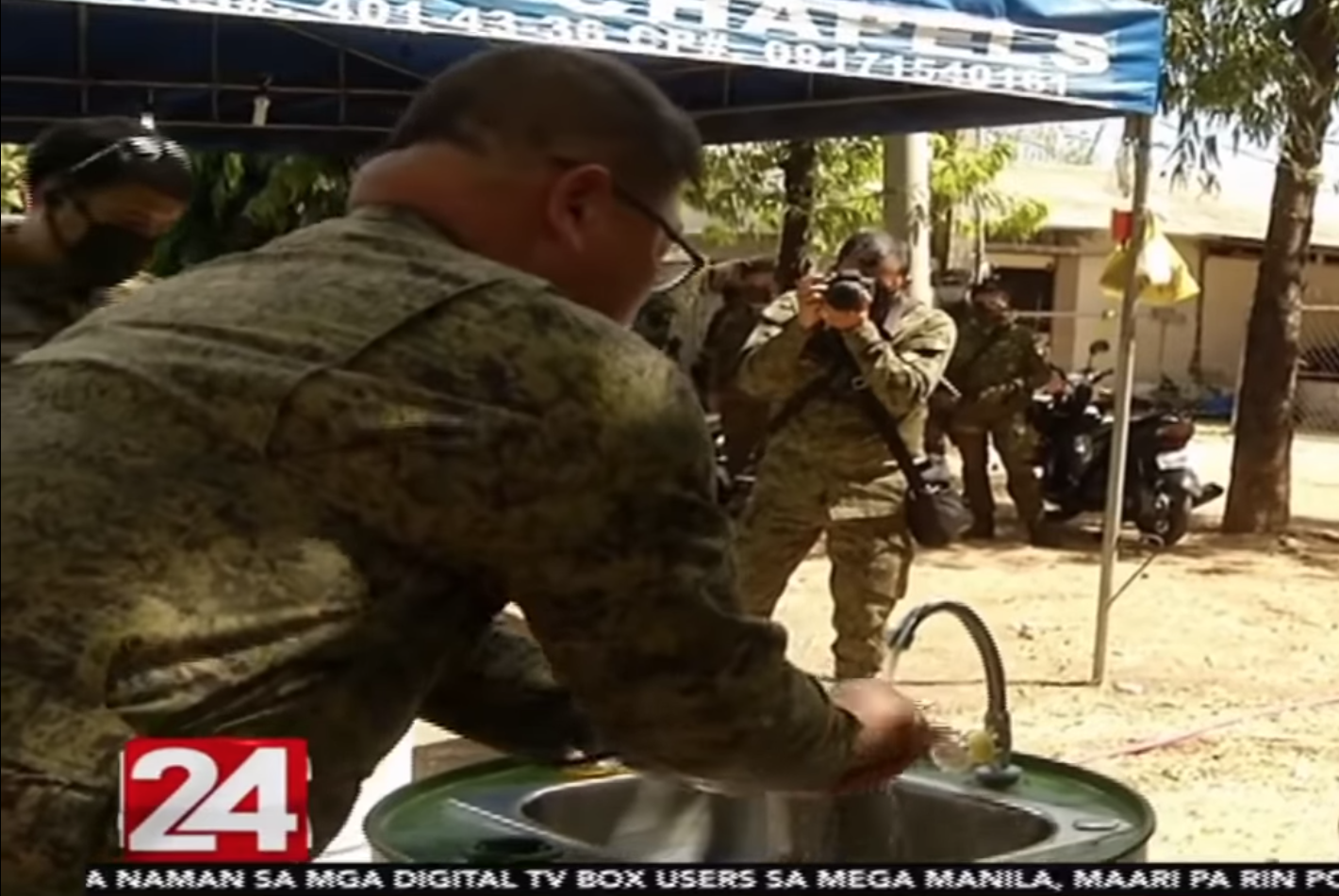 Army official leads set up of portable stations for hand-washing | GMA ...