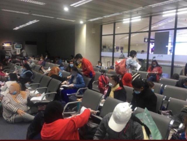 303 distressed OFWs from Kuwait who availed of amnesty arrive in Manila ...