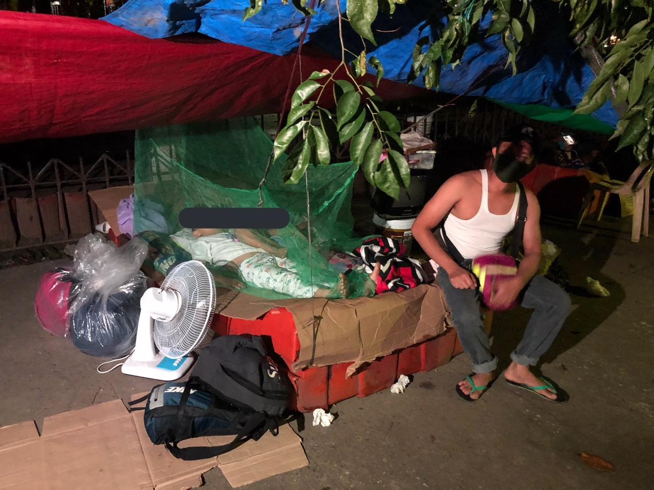 50 LSIs wait for Hatid Tulong program resumption on sidewalk near ...