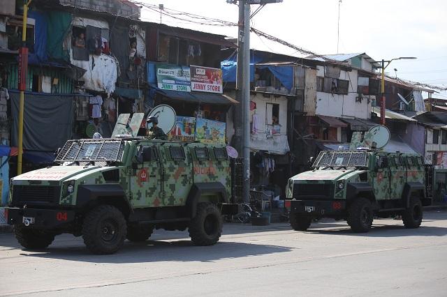 Police APCs deployed to Navotas to enforce lockdown | Photos | GMA News ...