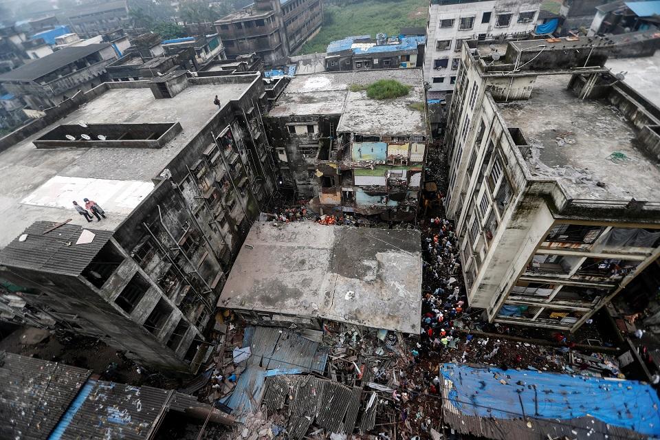 At least 13 dead, 25 feared trapped, in India building collapse | GMA ...