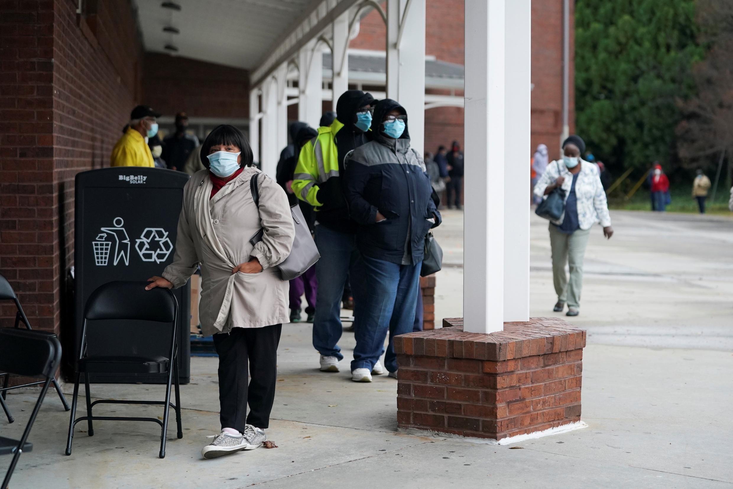 Hundreds line up to vote in Georgia elections that will set control of ...