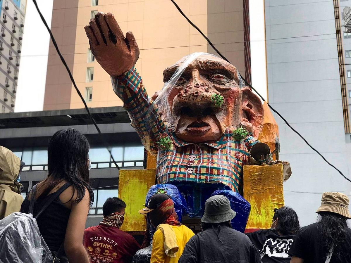 Duterte effigy takes highest spot in Manila's rights day rally | Photos ...