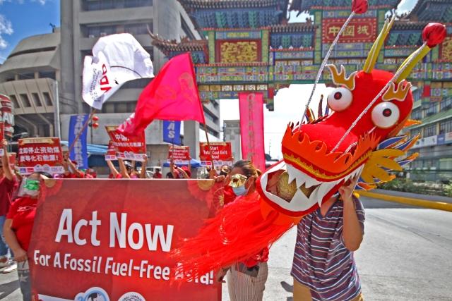 Environment activists perform dragon dance for fossil-free Asia ...