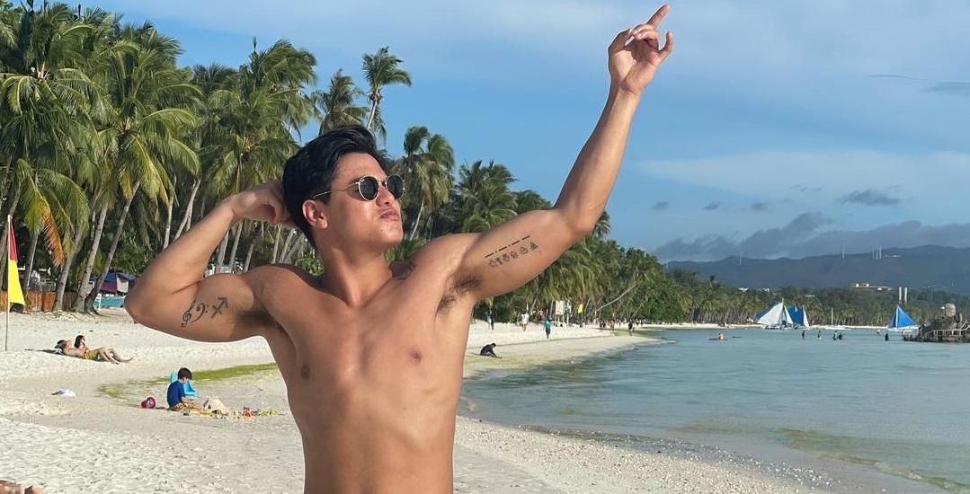 Migo Adecer flexes toned biceps in beach photo | GMA News Online