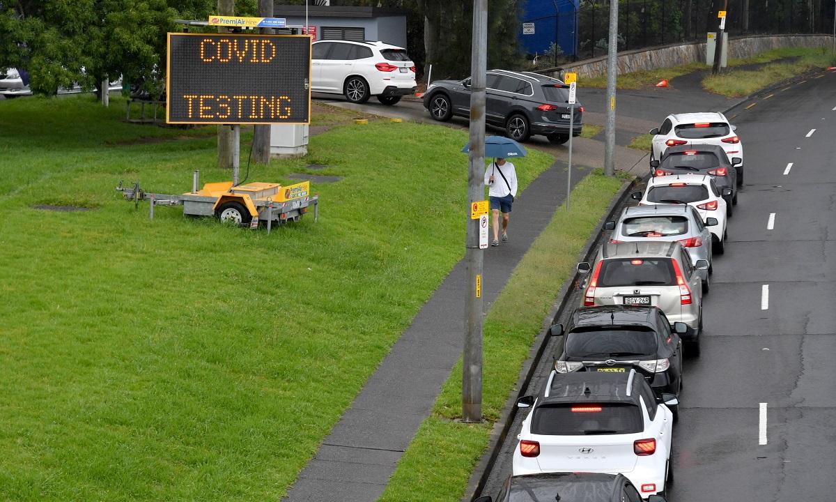 Australia COVID-19 cases surge, overloading testing system | GMA News ...