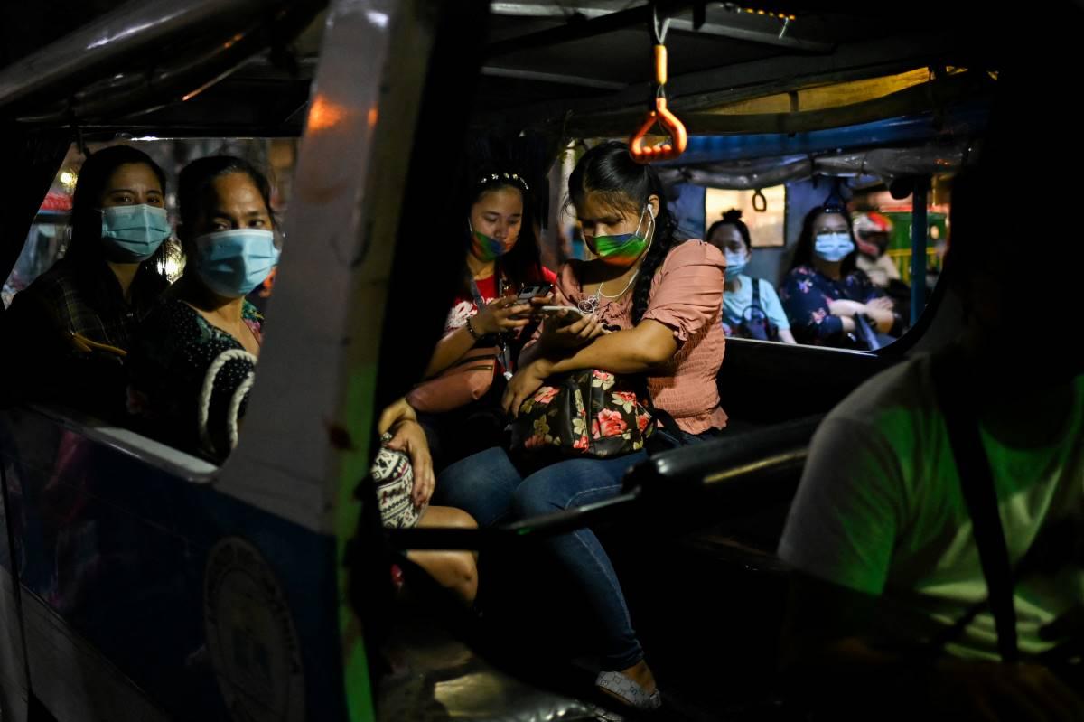 Commuters ride a tricycle during Alert Level 2 in Manila | Photos | GMA ...