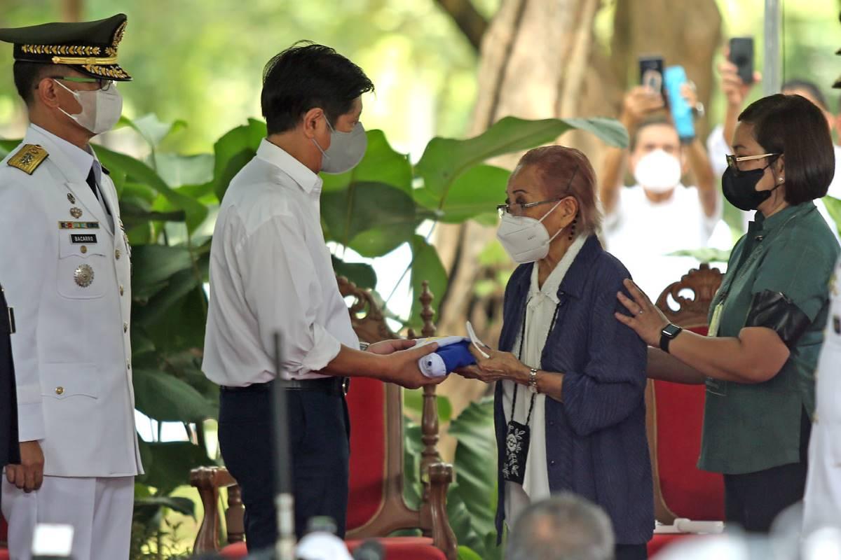 Marcos hands Philippine flag to FVR's widow Ming Ramos | Photos | GMA ...