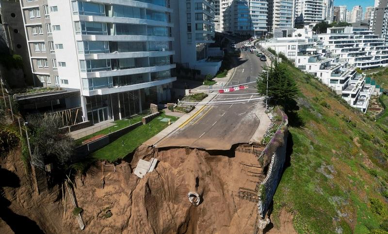 View of a massive landslide next to a building complex, after heavy ...