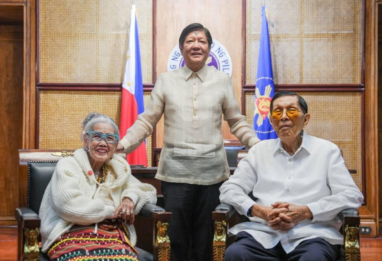 Marcos poses with extraordinary centenarians Enrile, Whang Od | Photos ...