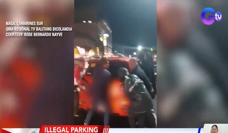 Kotseng nakaharang sa parking lot, pinagtulungang buhatin sa Camarines ...