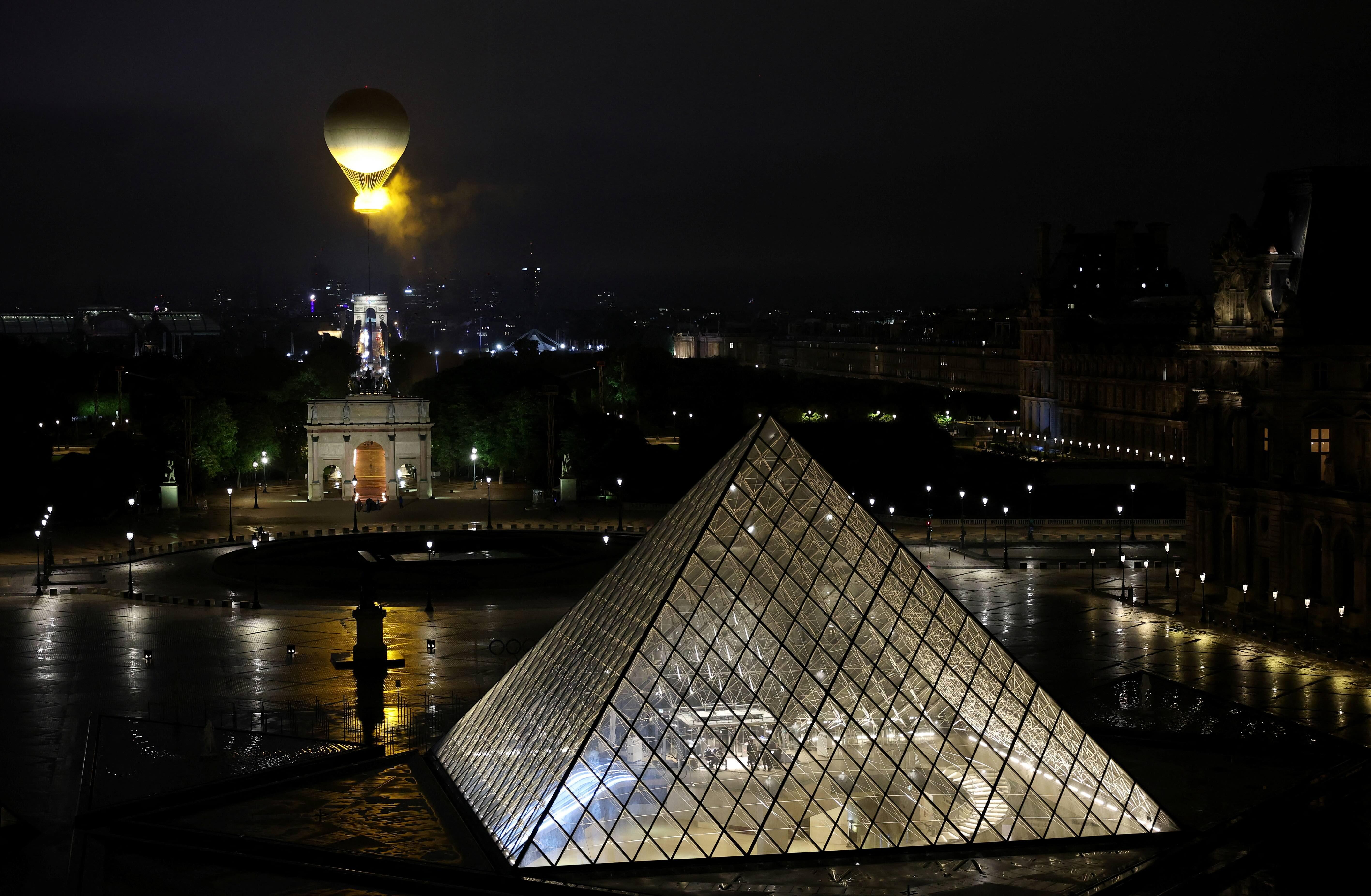 2024 Paris Olympics cauldron lighting seen near the Louvre | Photos ...