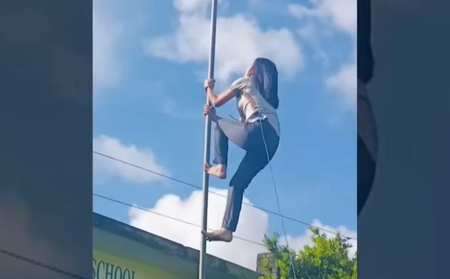 Batanes teacher fearlessly climbs flagpole | GMA News Online
