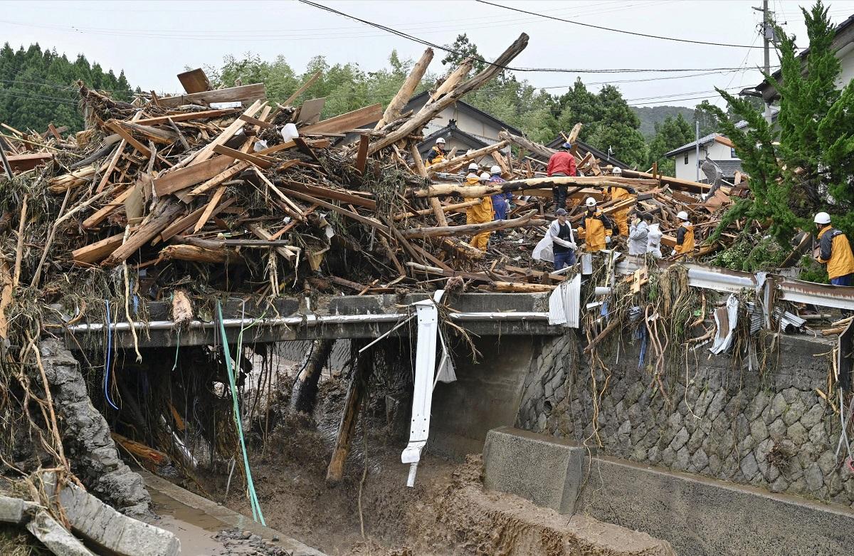 Rescuers comb muddy riverbanks after Japan floods kill seven | GMA News Online